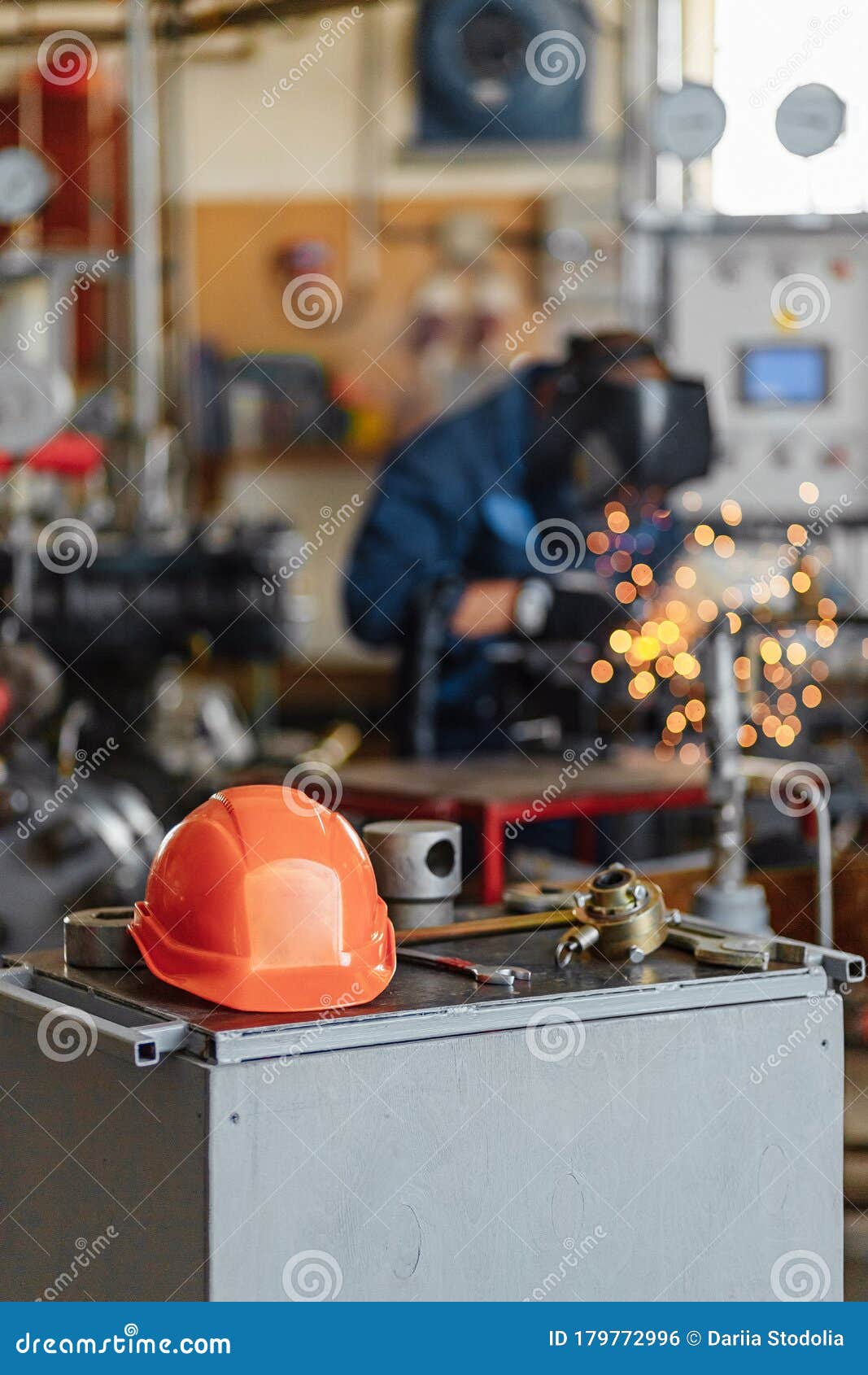 Welder, Bright Sparks from Welding. Helmet in the Foreground Stock ...