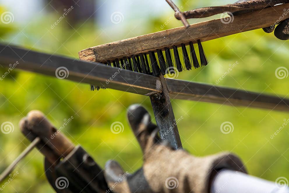 Welder Cleans the Welding Surface Using Wire Brush To Remove Residue ... Welder Cleans the Welding Surface Using Wire Brush To Remove Residue ...