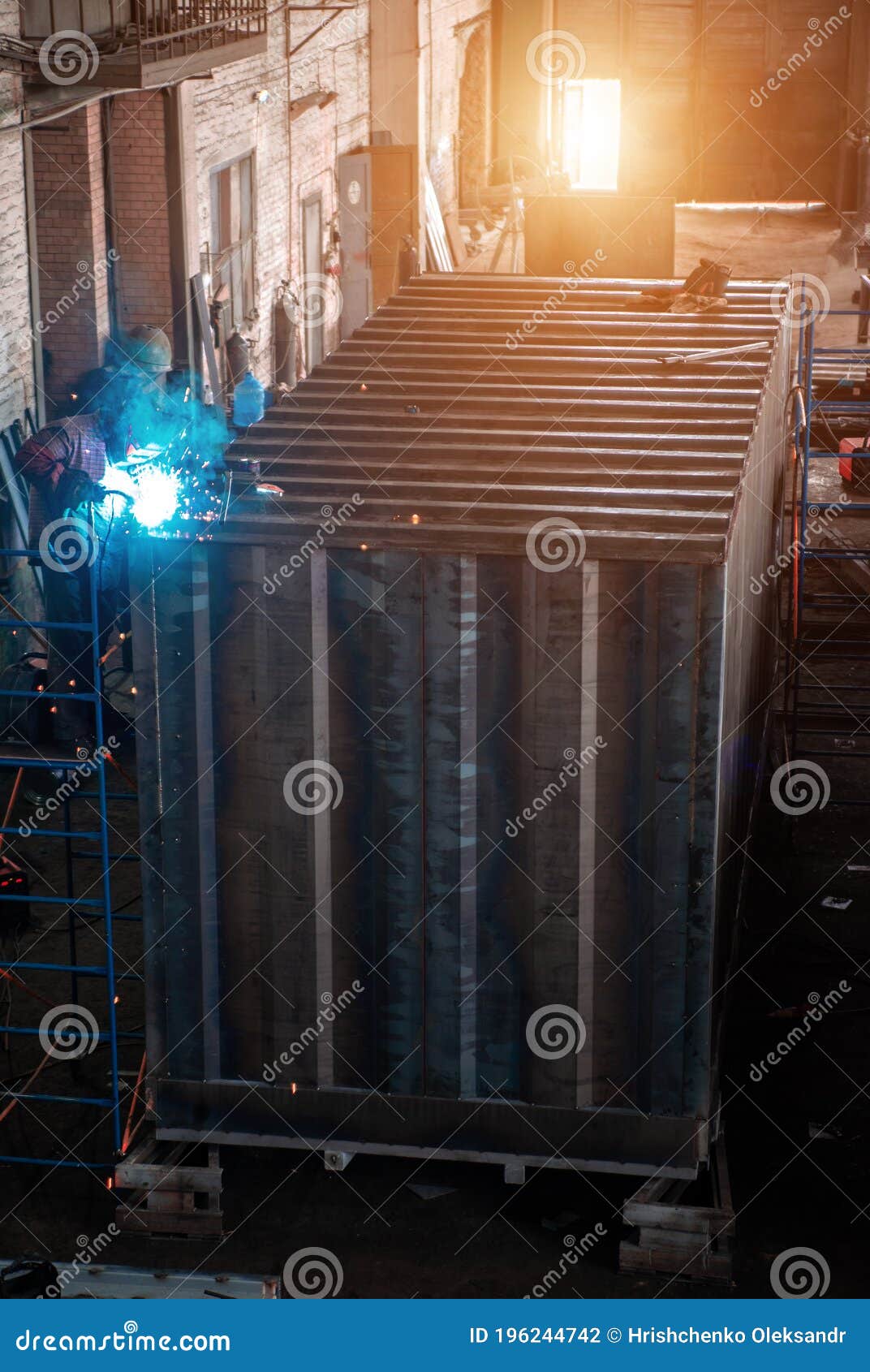 Welder Collects a Large Metal Container Stock Photo - Image of deliver ...