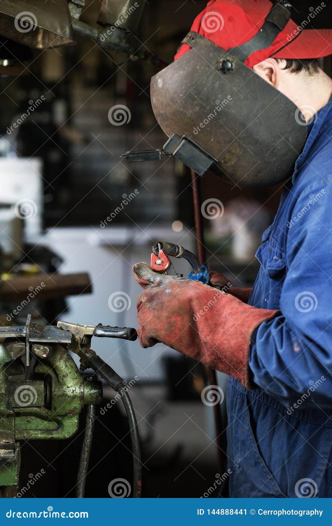 Welder Cuts Iron from Welding Machine, Welder is Welding in the Garage ...
