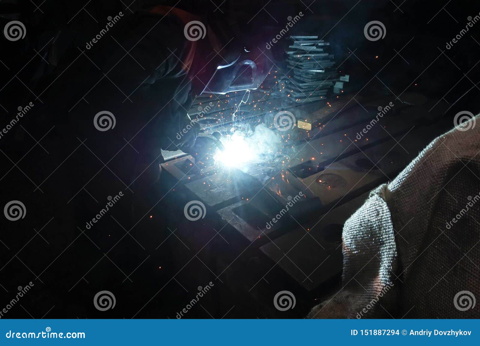 The Welder is Engaged in Performing Welding Work with the Help of ...