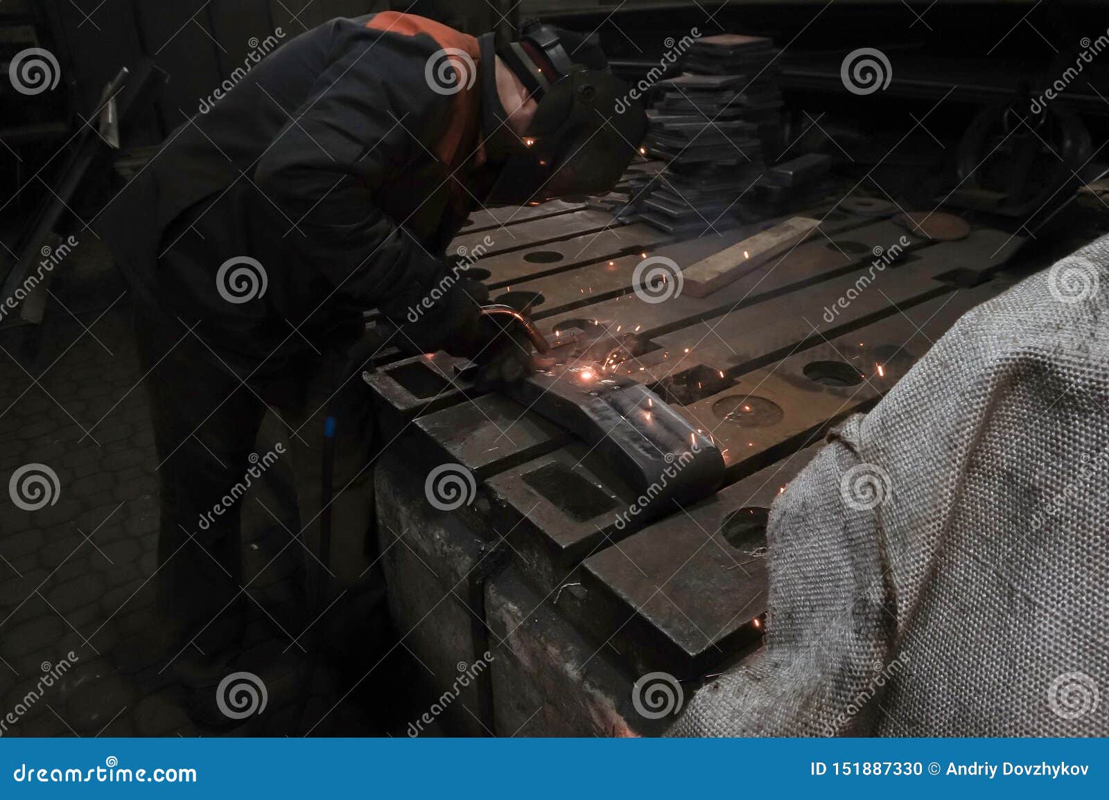 The Welder is Engaged in Performing Welding Work with the Help of ...