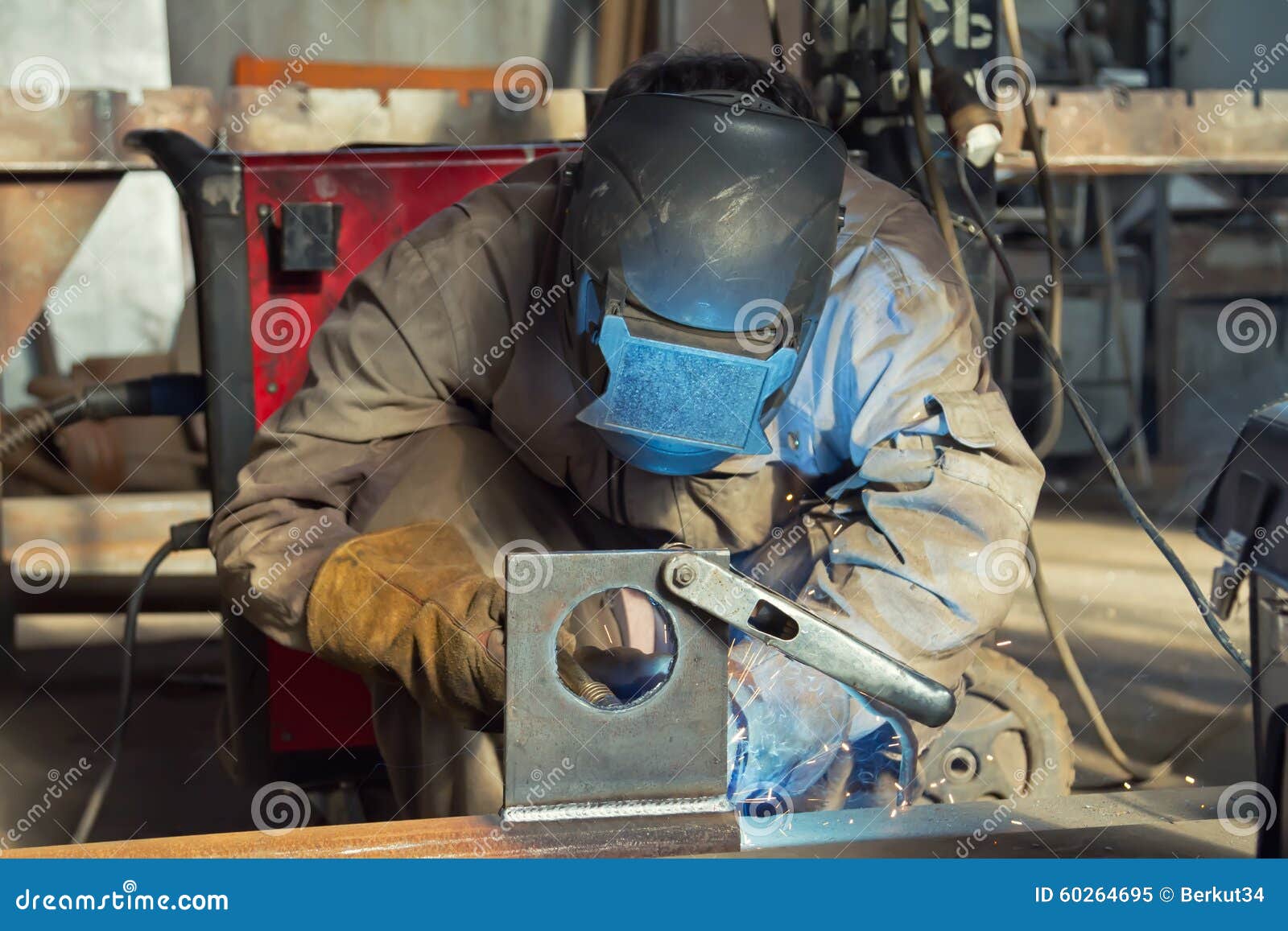 A Welder Fabricates Steel Structures Using Semi-automatic Weldin Stock ...