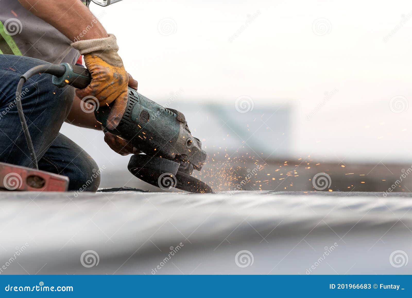 Welder is Grinding the Welding of Large Pipe. Grinding is an Abrasive ...