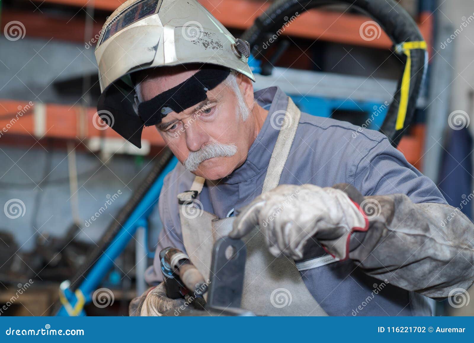 Welder inspecting his work stock photo. Image of metal - 116221702