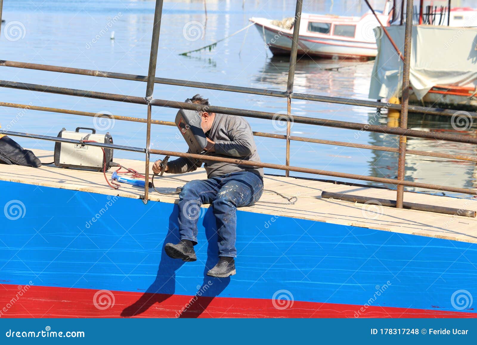 A Welder is Mending the Ship Stock Photo - Image of protective, welding ...