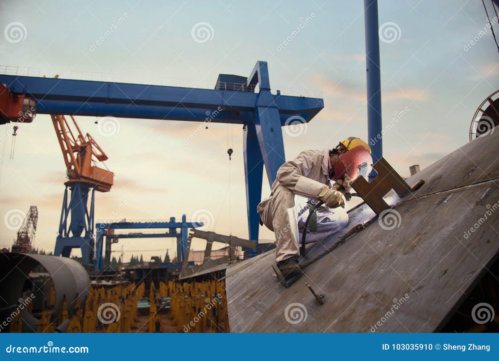 A welder at a shipyard stock photo. Image of worker - 103035910