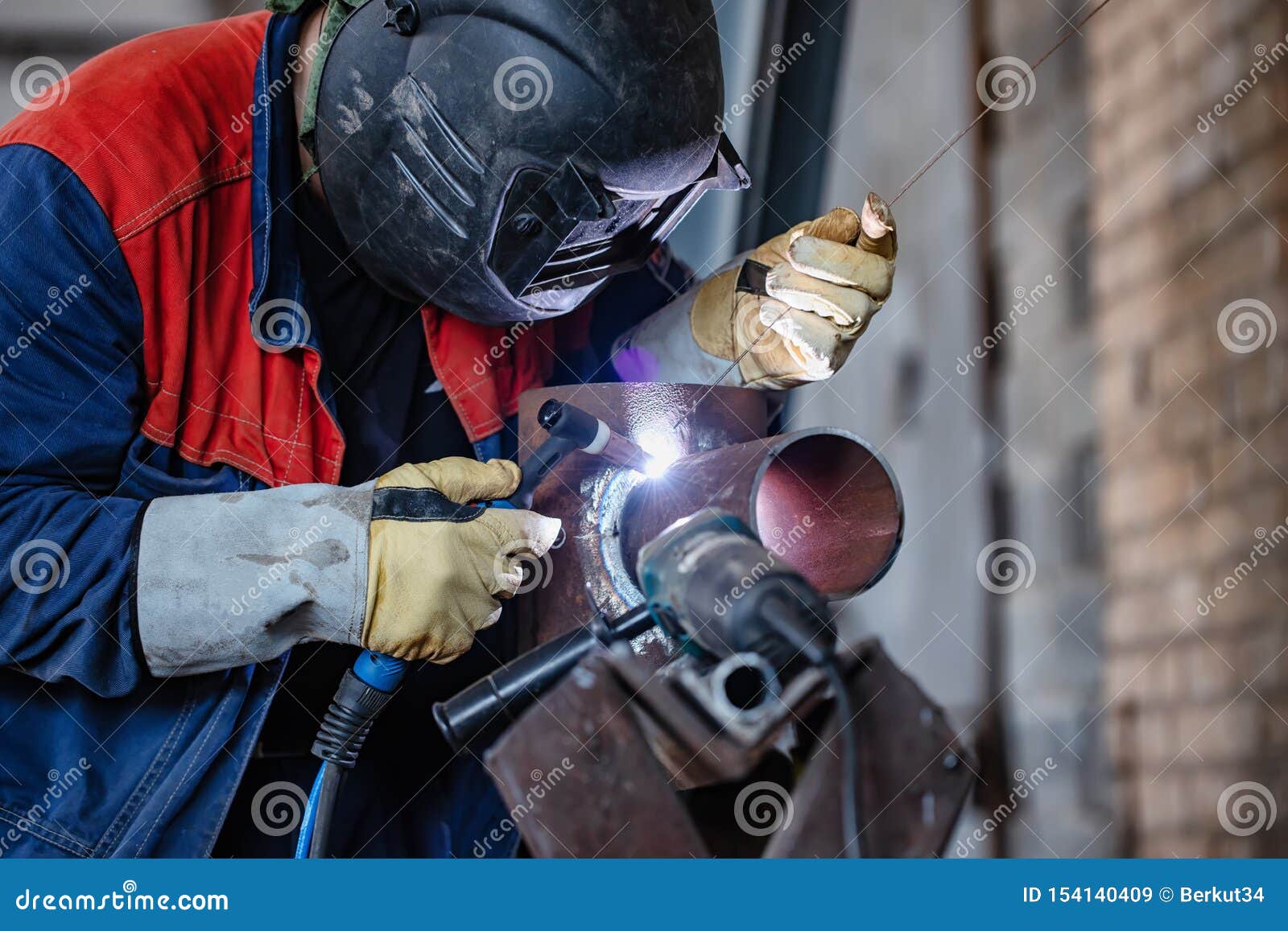Welder in the Shop Weld Sample from the Tube for Passing of ...