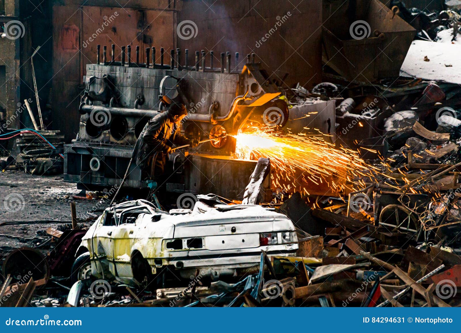 Welder with Soldering Iron Inside a Scrapyard. Editorial Photo - Image ...