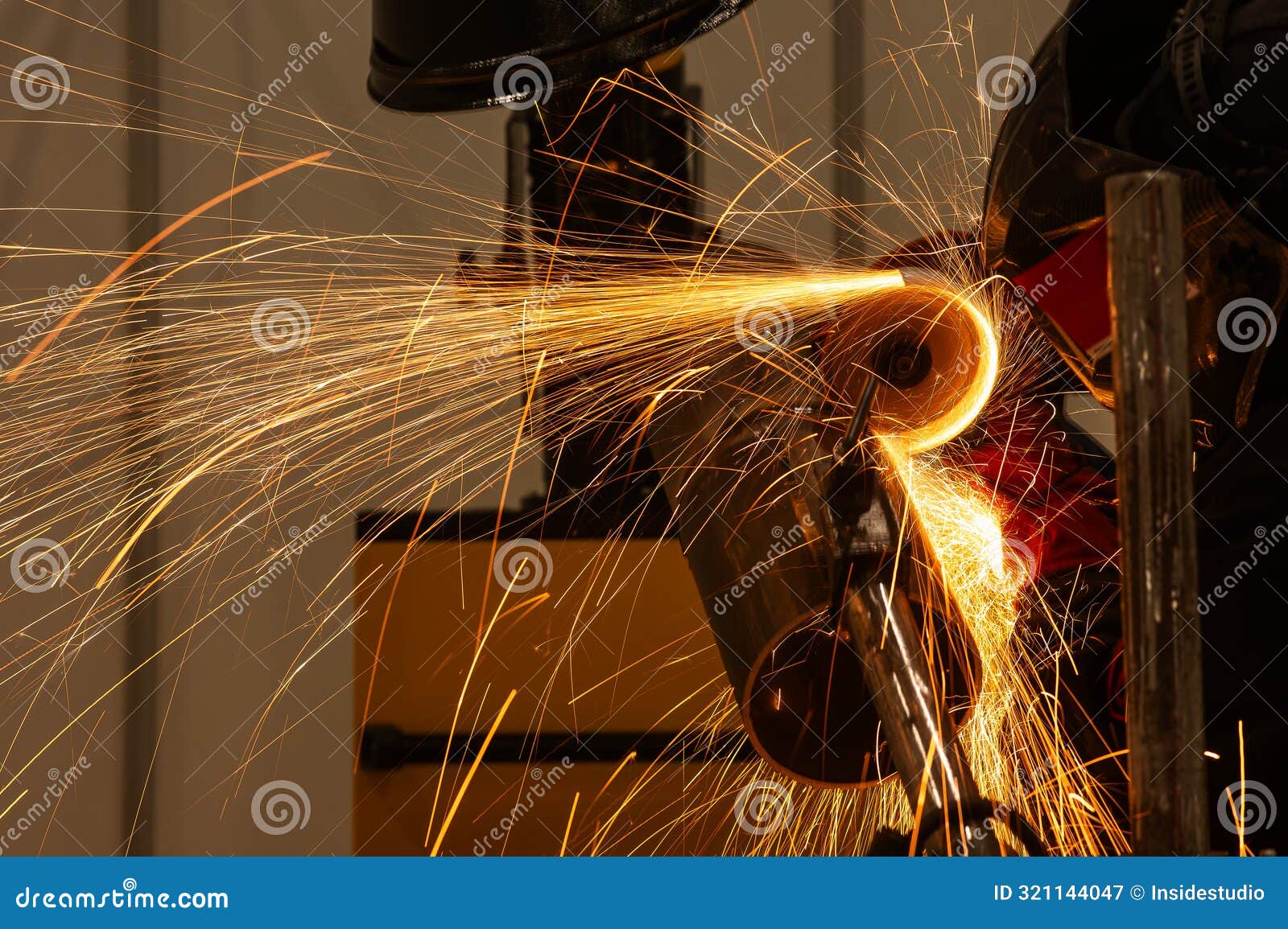 A Welder Wearing a Protective Mask Cuts a Metal Pipe. Stock Image ...