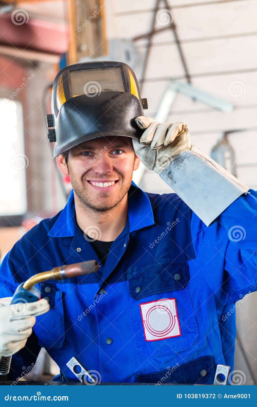 Welder with Welding Device in Metal Workshop Stock Photo - Image of ...