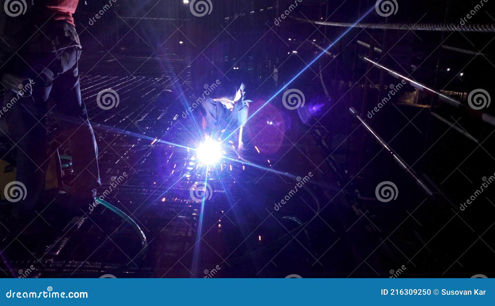 A Welder is Welding at Night Time for Slab Concrete Casting in a ...