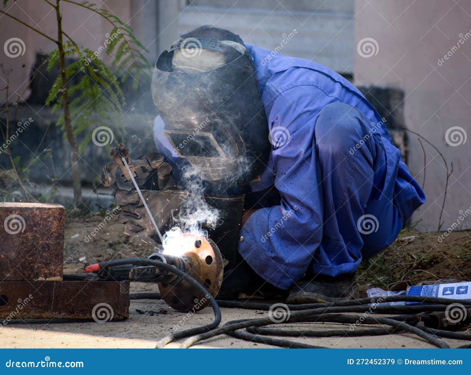 A welder welding stock image. Image of screenshot, concentration ...