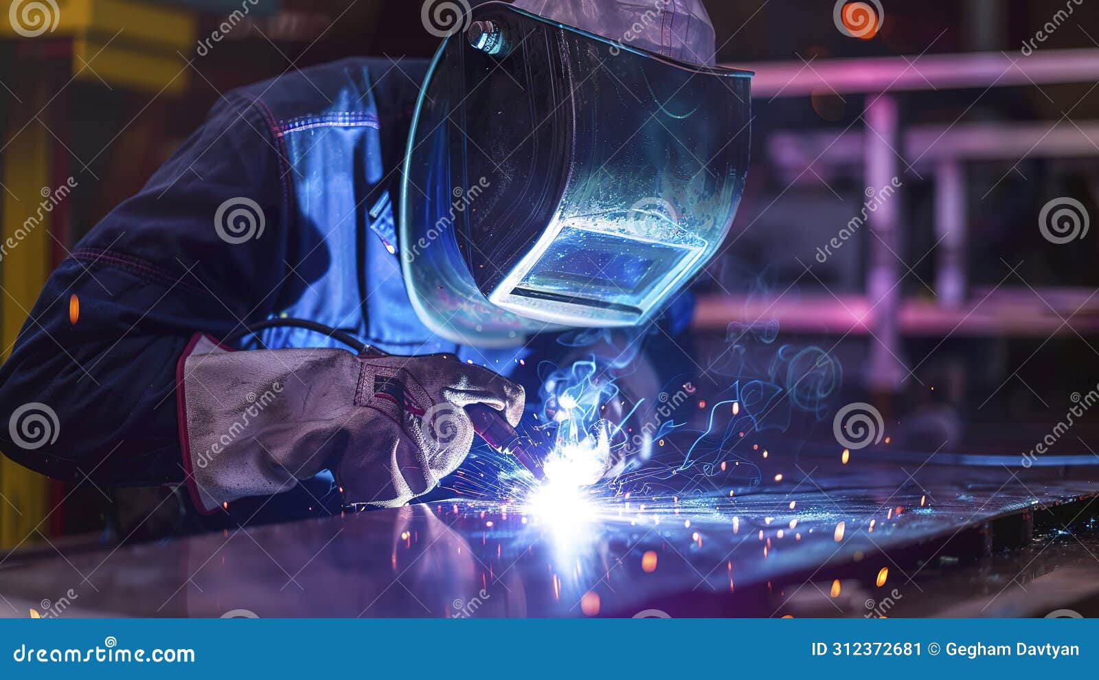 Welder is Welding in the Workstation, Welder at the Workstation, Welder ...