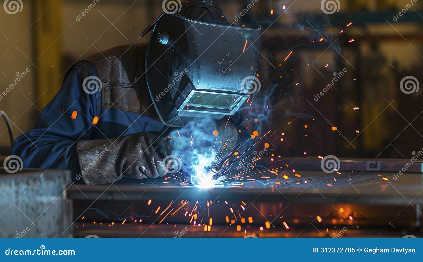 Welder is Welding in the Workstation, Welder at the Workstation, Welder ...