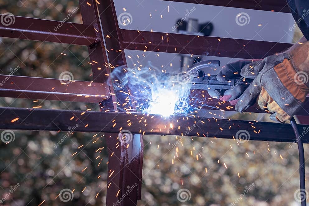 Welder Welds Metal by Arc Welding, Welding of Metal Structures Stock ...
