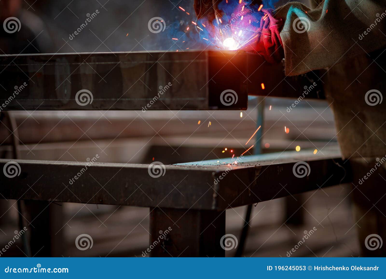 Welder Welds Pieces of Iron in a Factory Stock Image - Image of flash ...
