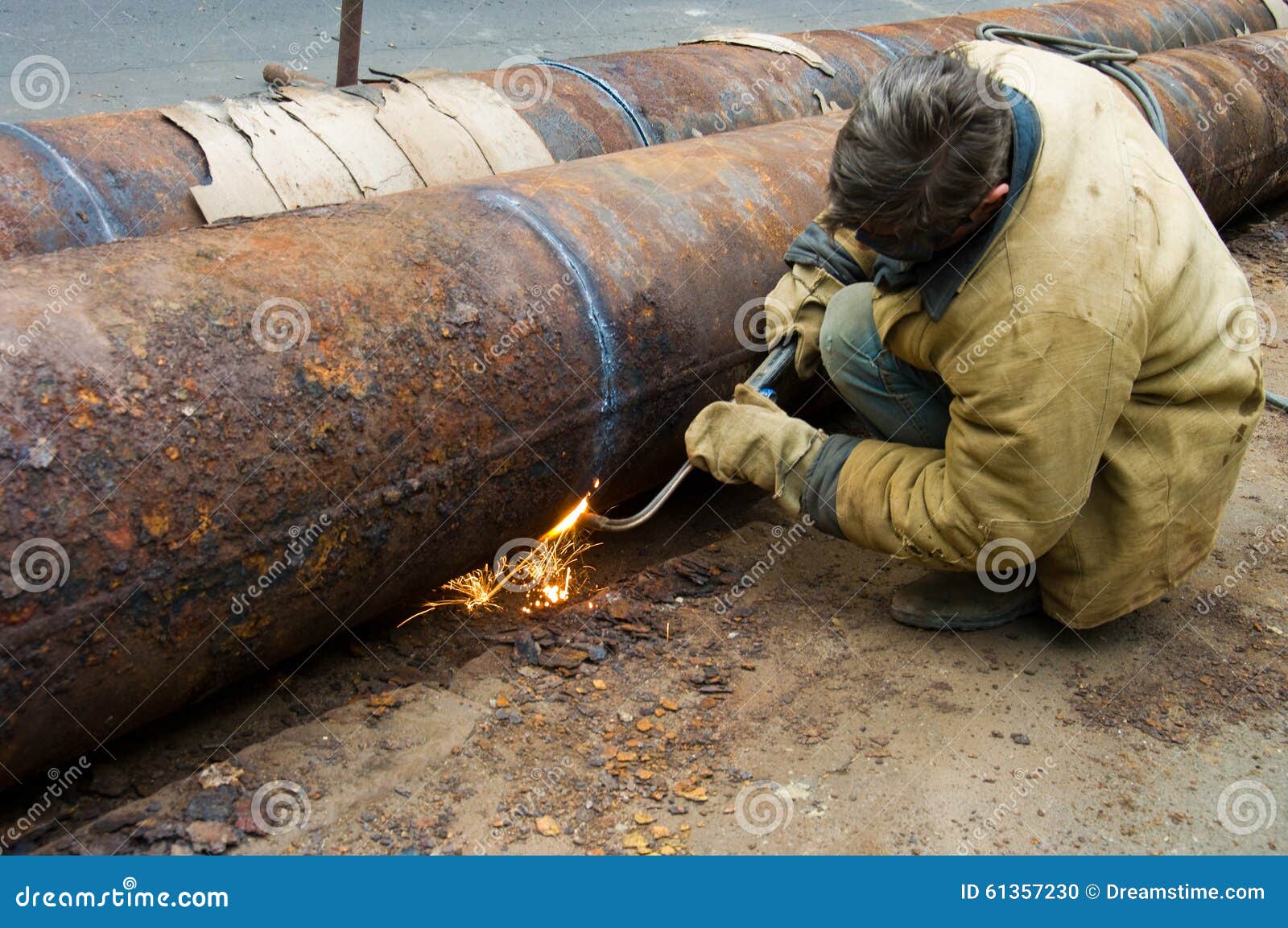 Welder Welds Pipe Segments. Repair and Replacement of Outdated P ...