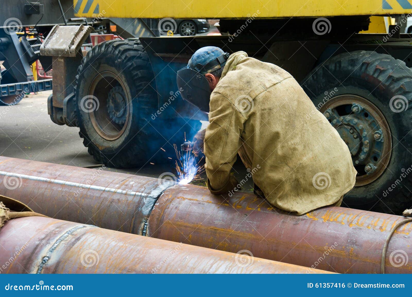 Welder Welds Pipe Segments. Repair and Replacement of Outdated P ...