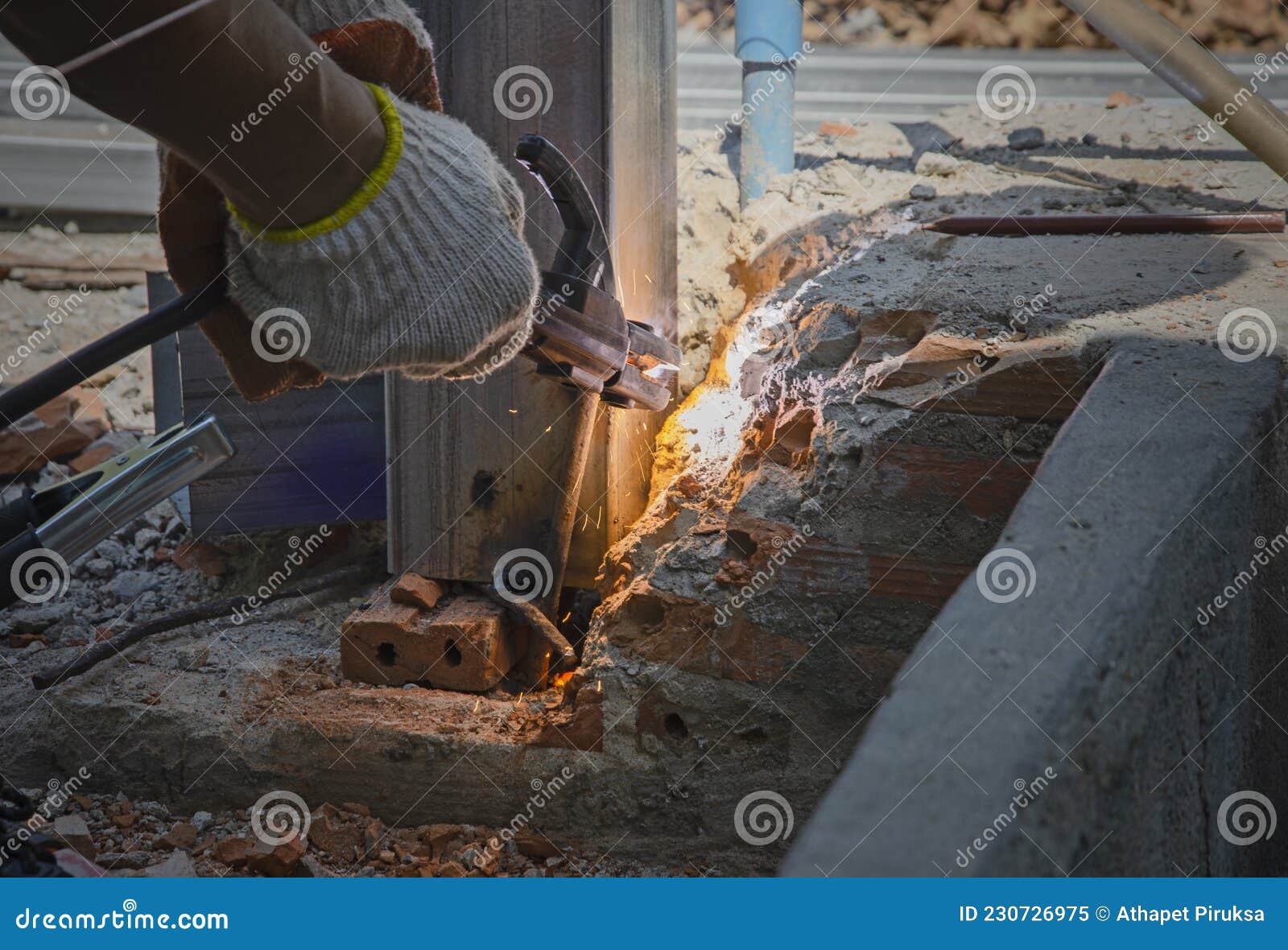 Welder Welds Steel Wire and Pole in Construction Site Stock Image ...