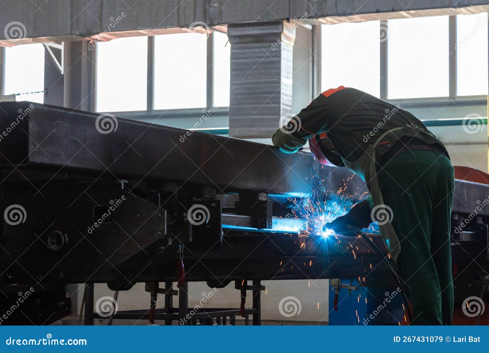 Welder at Work. Welding Metal Part in an Industrial Environment Stock ...