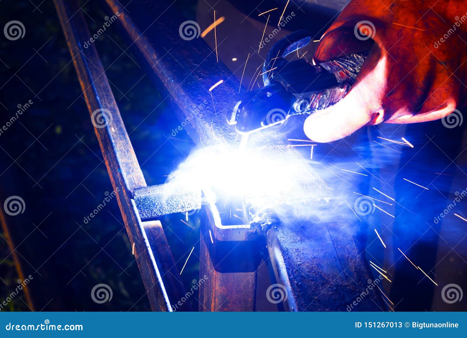 Welder Worker Performs Jump Welding. Man Welder in Protective Gloves ...