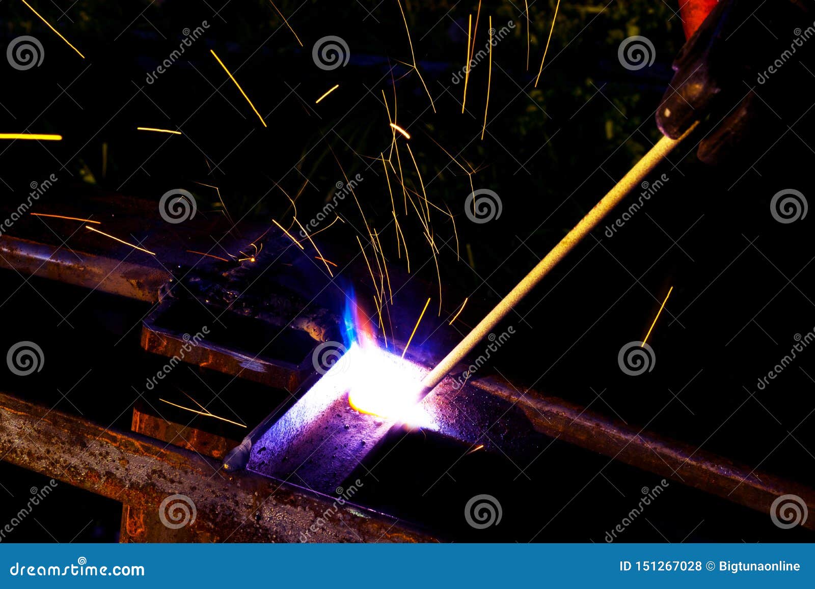 Welder Worker Performs Jump Welding. Man Welder in Protective Gloves ...