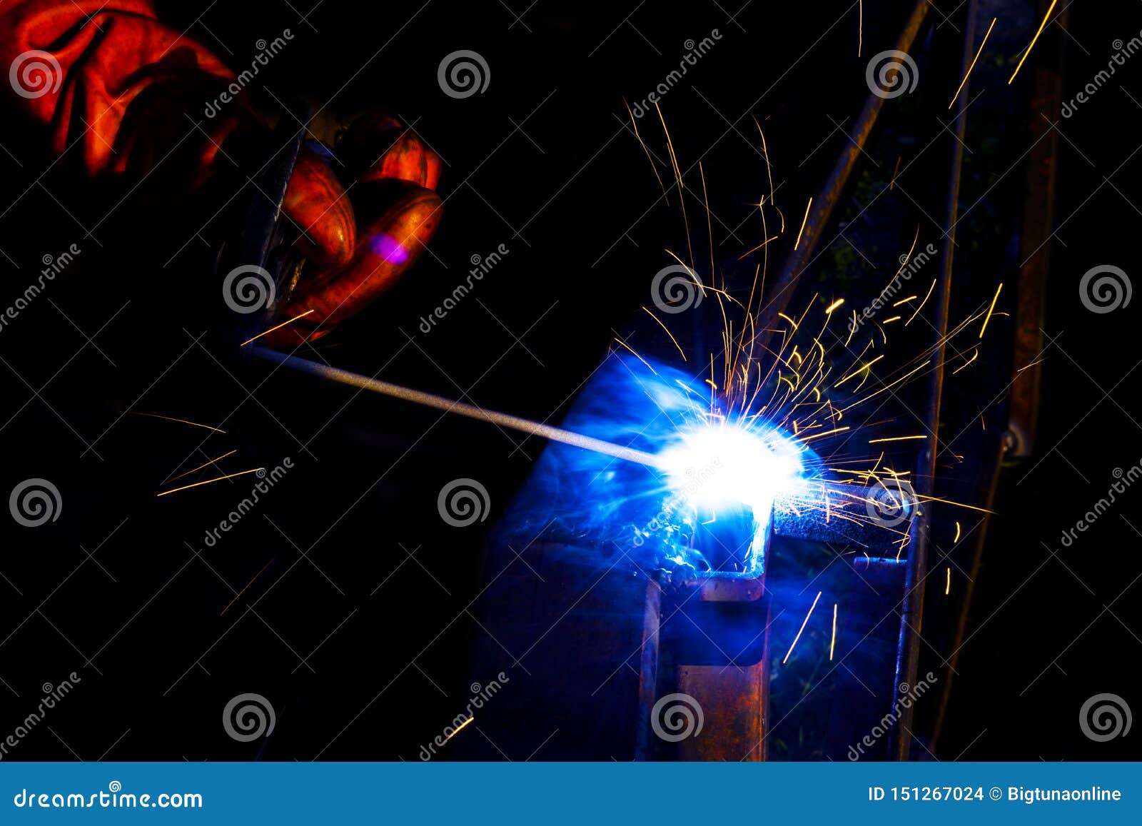 Welder Worker Performs Jump Welding. Man Welder in Protective Gloves ...