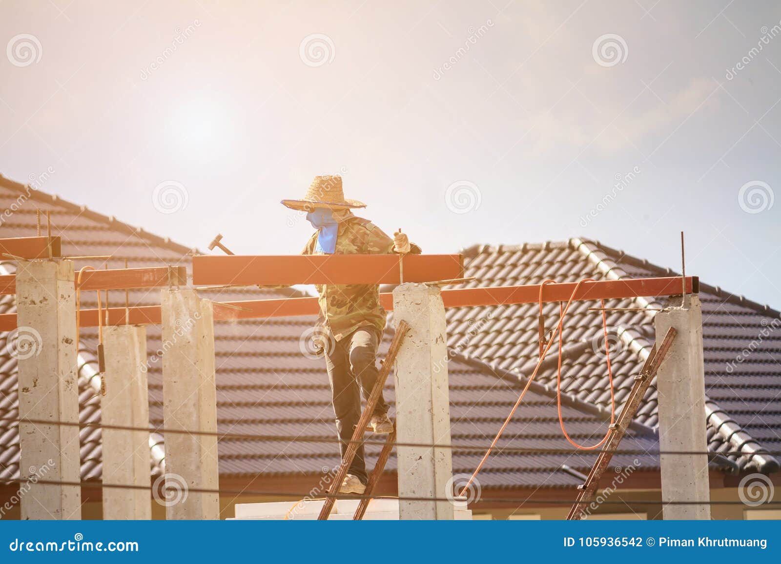 Welder Workers Installing Steel Frame Structure of the House Editorial ...