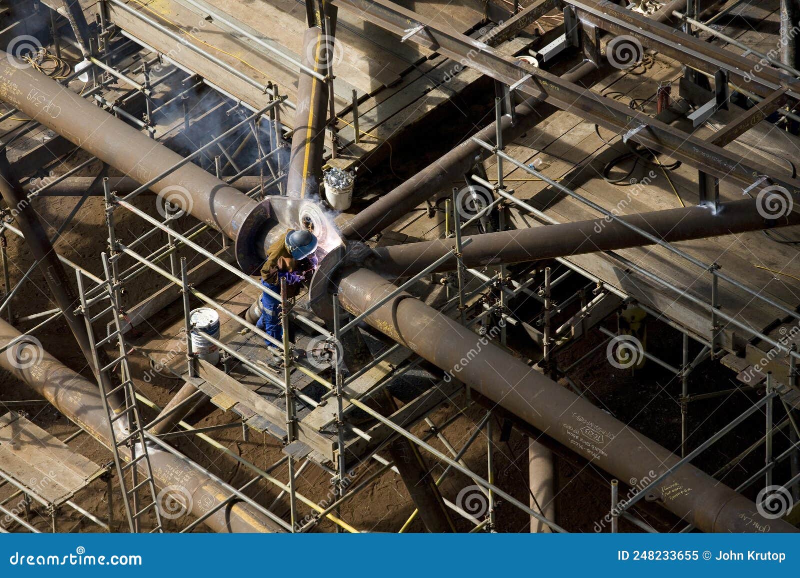 A Welder Working on a Massive Steel Jacket -the First Installed Section ...