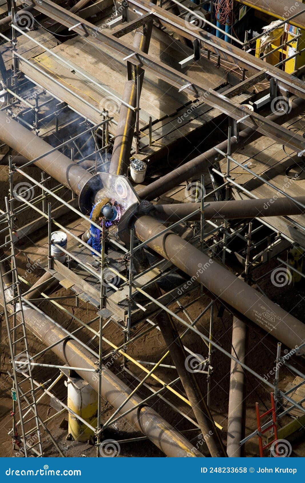 A Welder Working on a Massive Steel Jacket -the First Installed Section ...