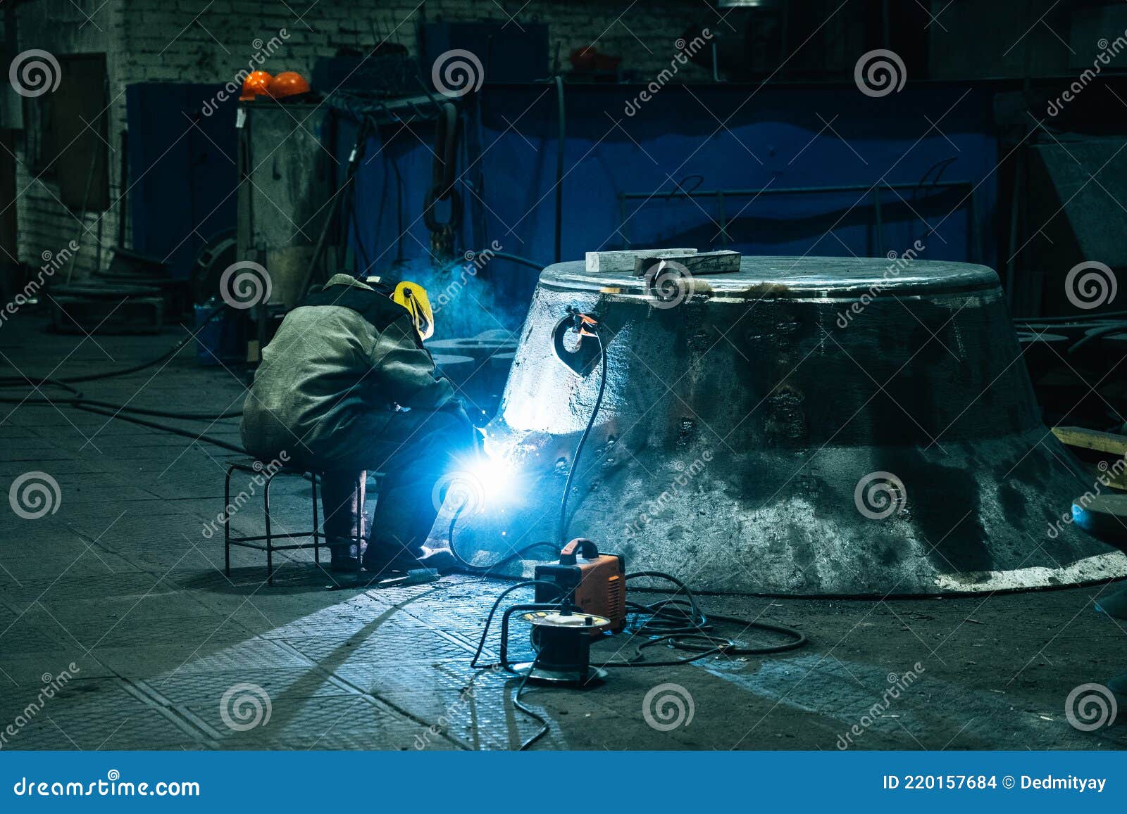 Welder Works in Industrial Workshop. White Flashes and Welding Smoke ...