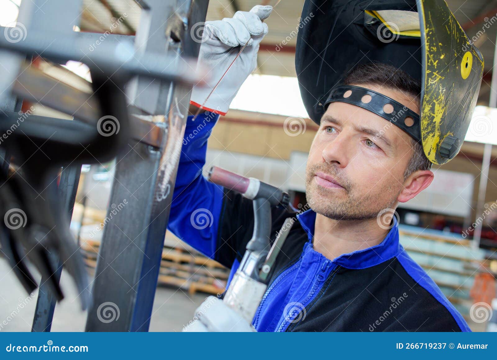 Welder in workshop stock image. Image of detail, worker - 266719237