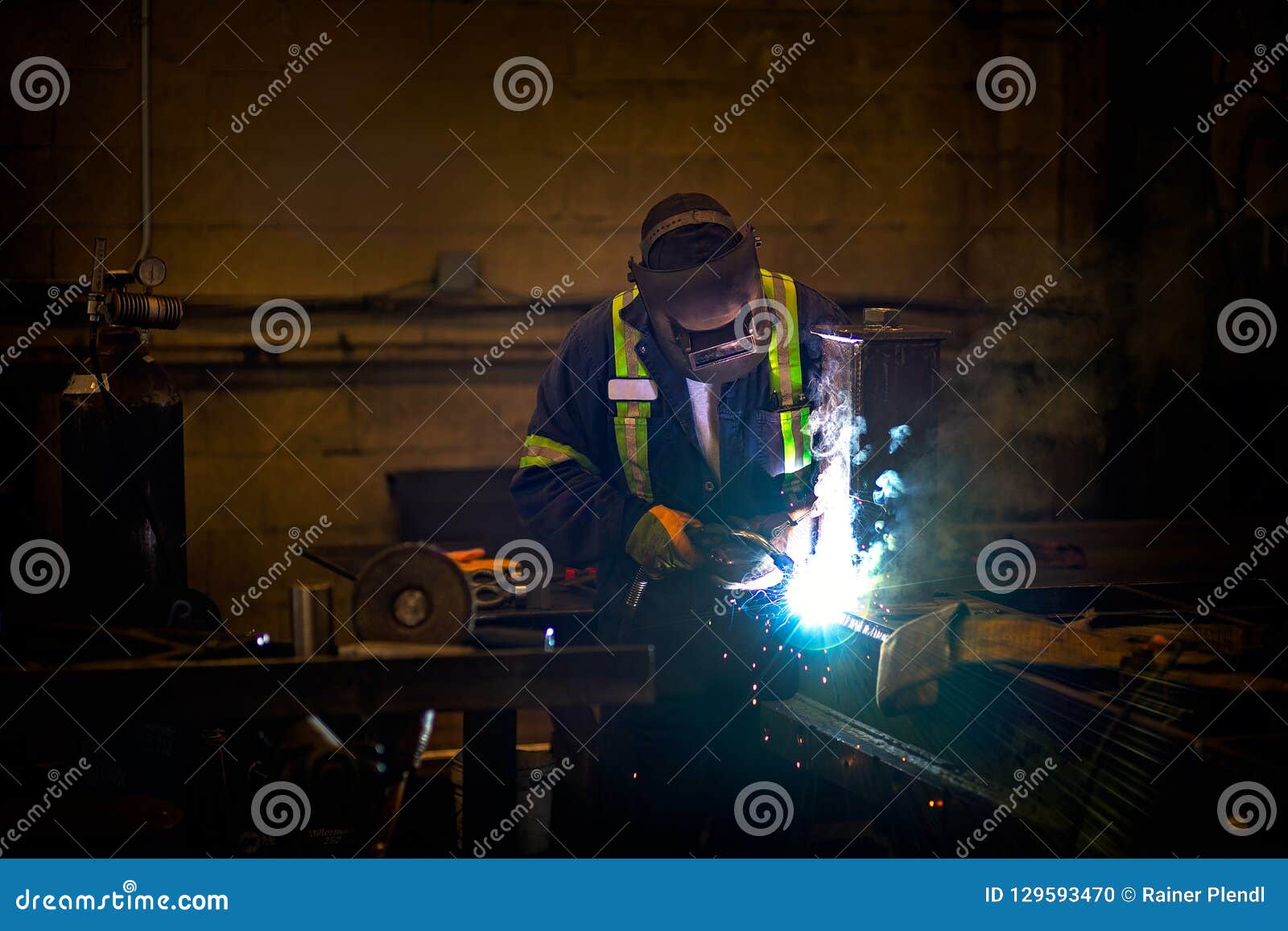 Welding in a factory stock photo. Image of mask, assembly - 129593470