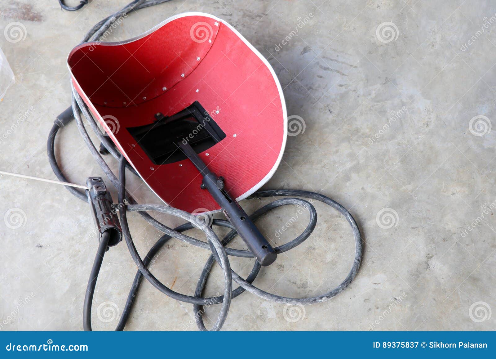 Welding mask on ground stock image. Image of metal, tool - 89375837