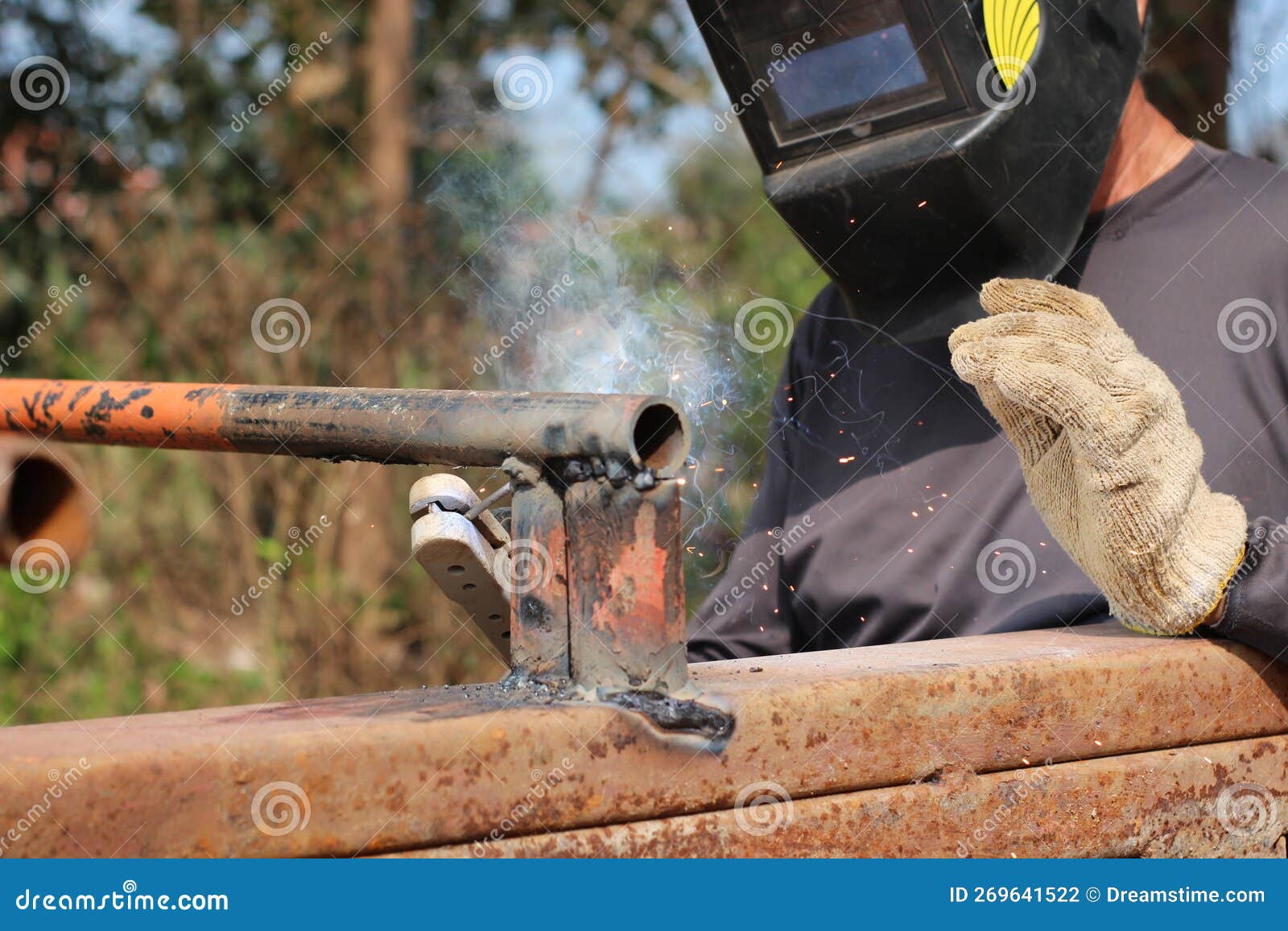 Welding Steel that Produces Smoke and Sparks Stock Photo - Image of ...