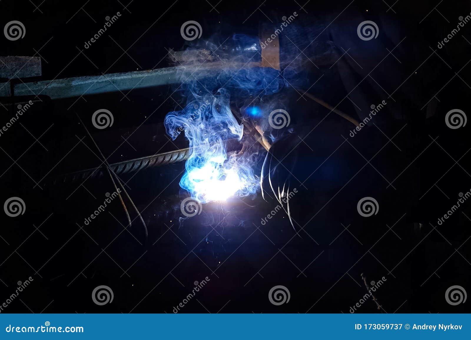 Welding of Steel Reinforcement. Sparks and Light from Welding. E Stock ...