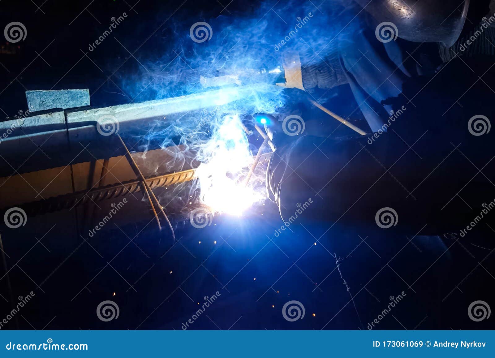 Welding of Steel Reinforcement. Sparks and Light from Welding Stock ...
