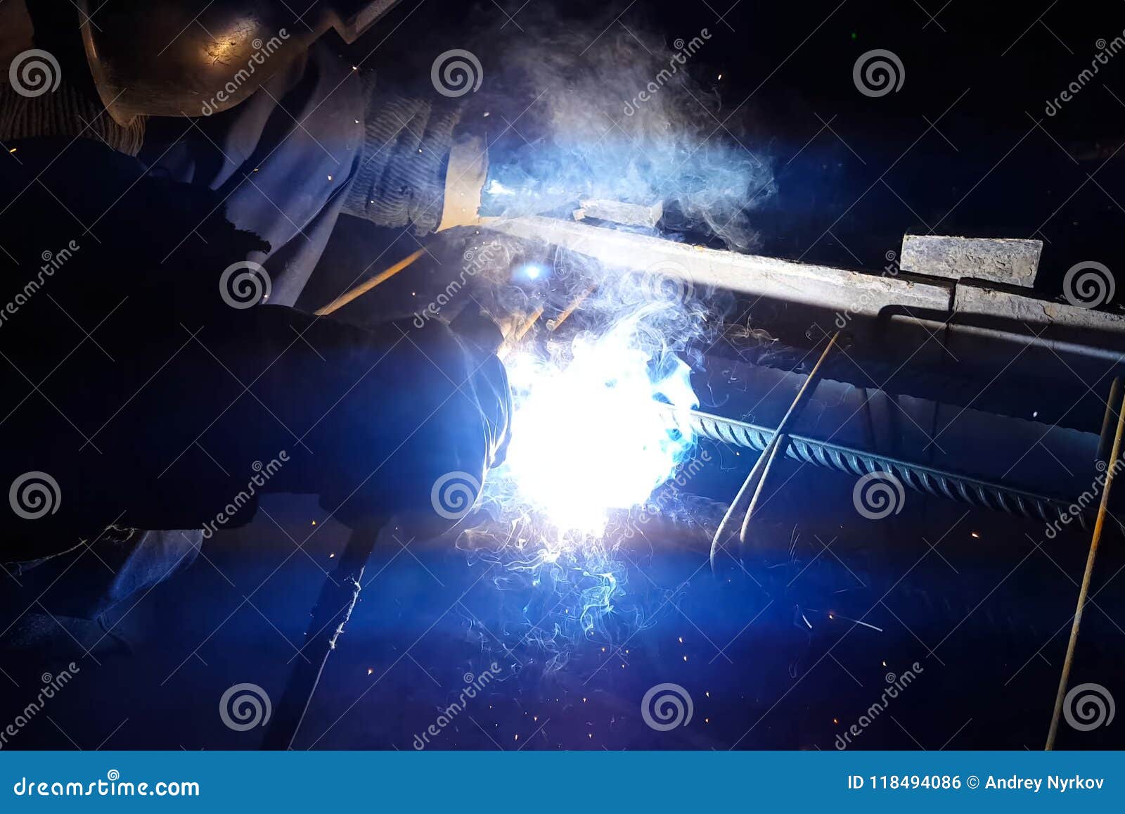 Welding of Steel Reinforcement. Sparks and Light from Welding Stock ...