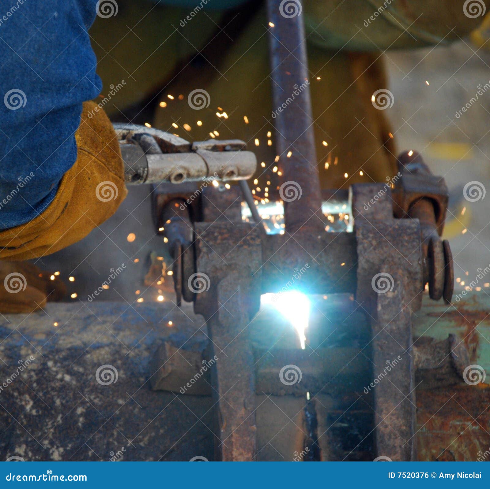 Welding two pipes together stock photo. Image of blue - 7520376