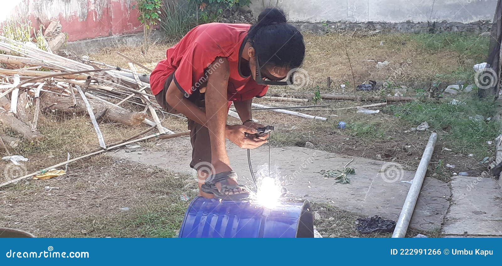 Welding Used Drums To Be Used As a Trash Can Stock Photo - Image of ...