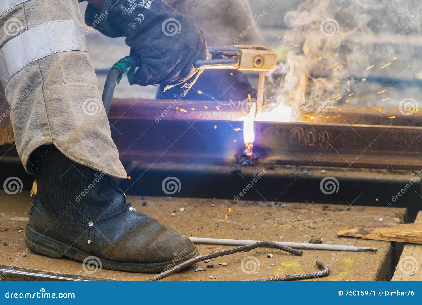 Welding Works On Welding Of Metal Structures. An Electric Welder Works ...