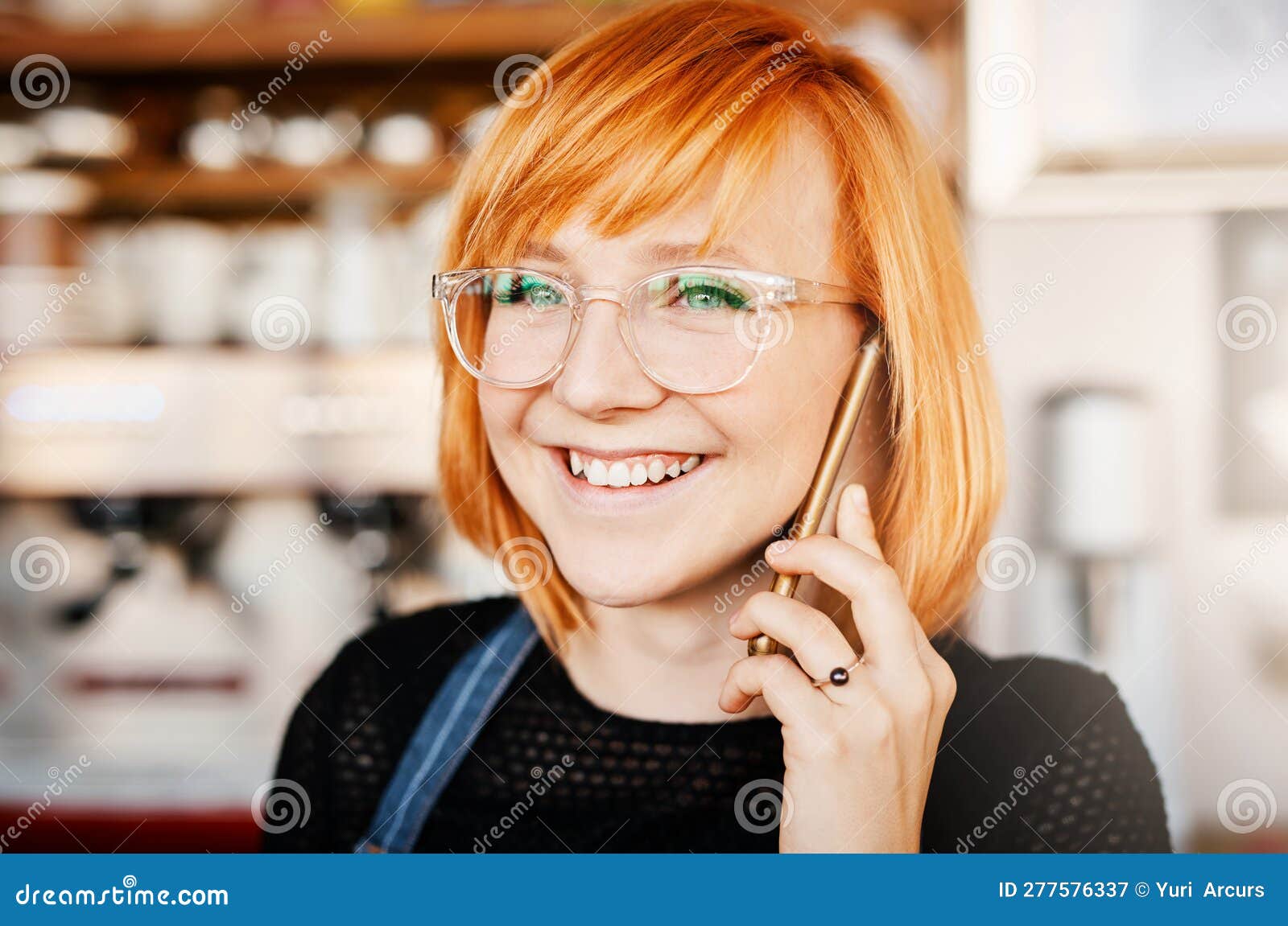 Well Be Open until Late. a Shop Assistant Talking on Her Cellphone ...