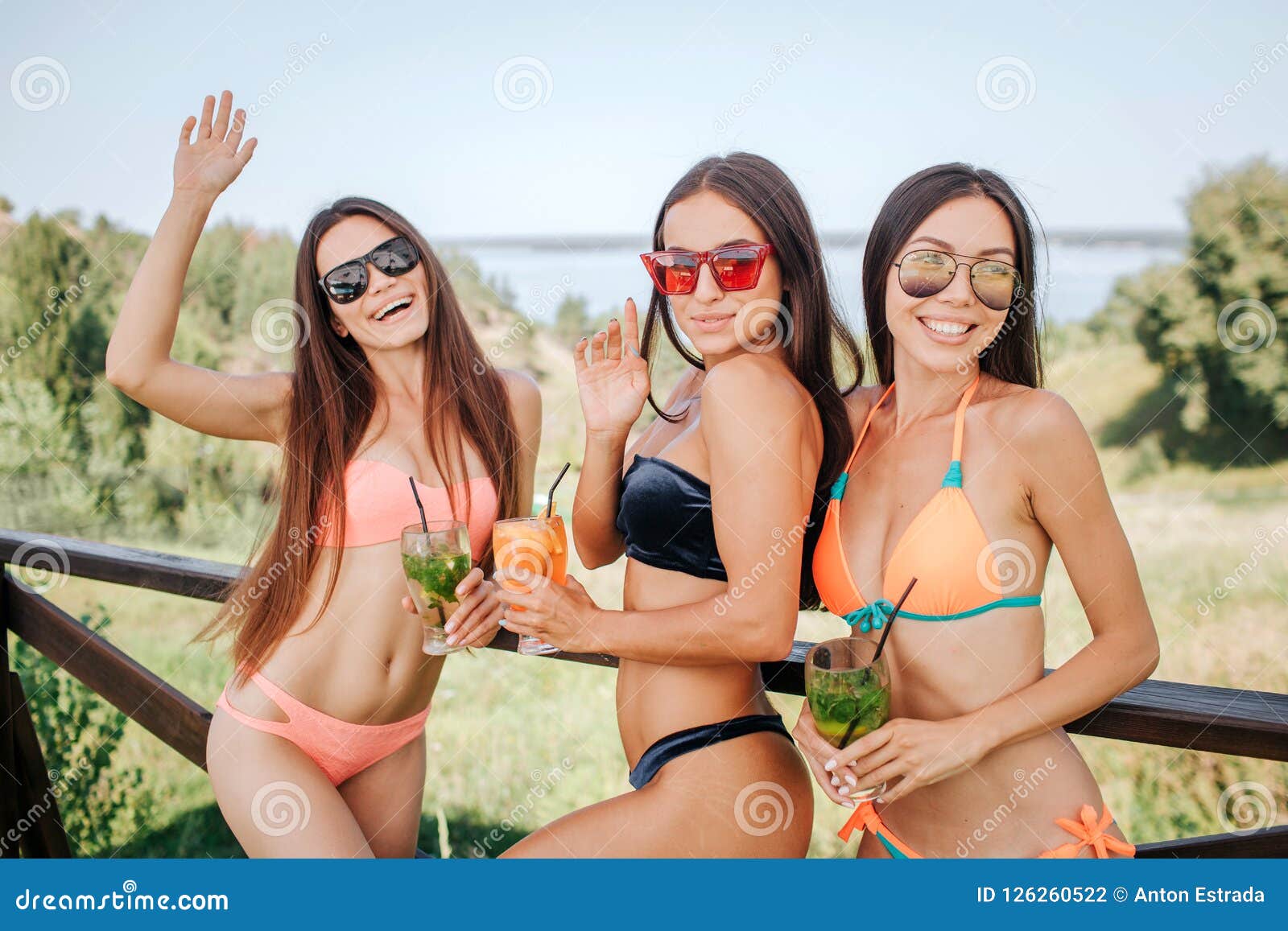 Well-built and Gorgeous Girls Stand and Pose on Camera. they Holds ... Well-built and Gorgeous Girls Stand and Pose on Camera. they Holds ...