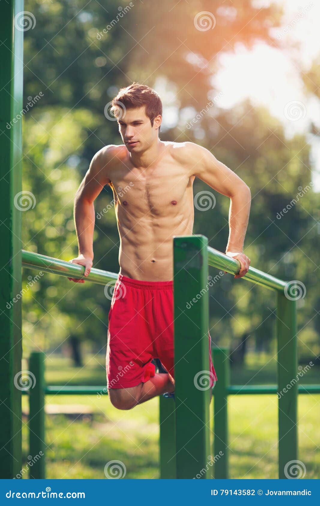 Well Built Muscular Man Doing a Physical Exercise Stock Photo - Image ...