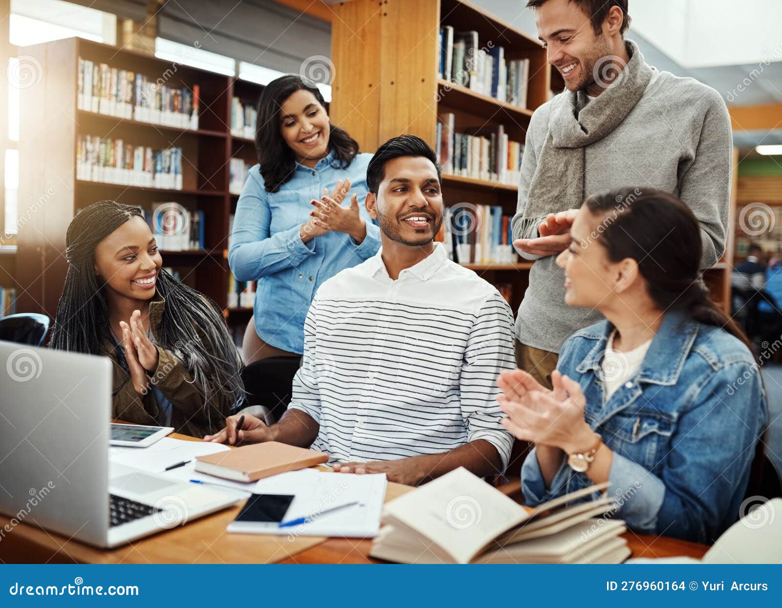 Well Done. a Group of University Students Studying in the Library ...