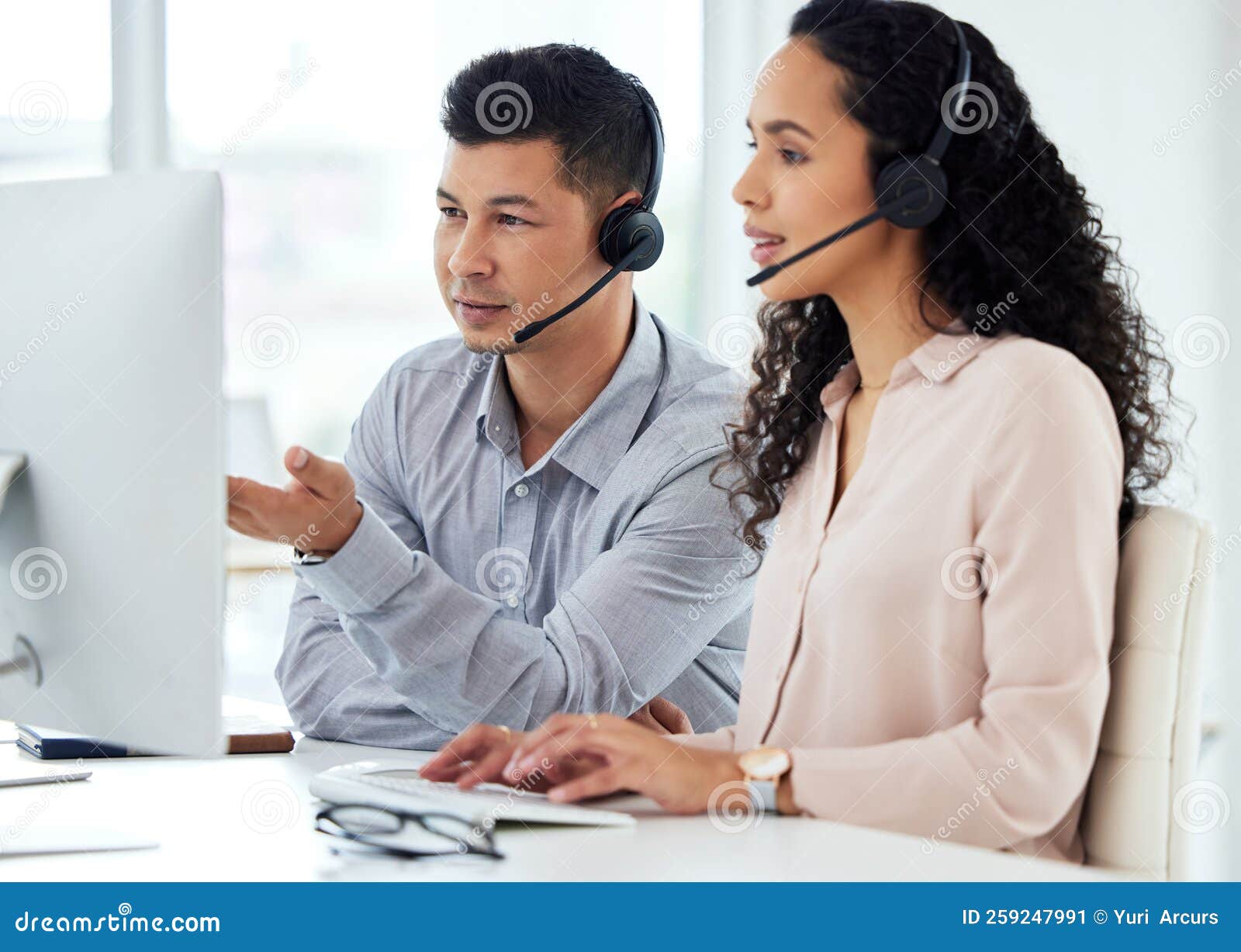 Well Figure this Out Together. Two Call Centre Agents Working Together ...