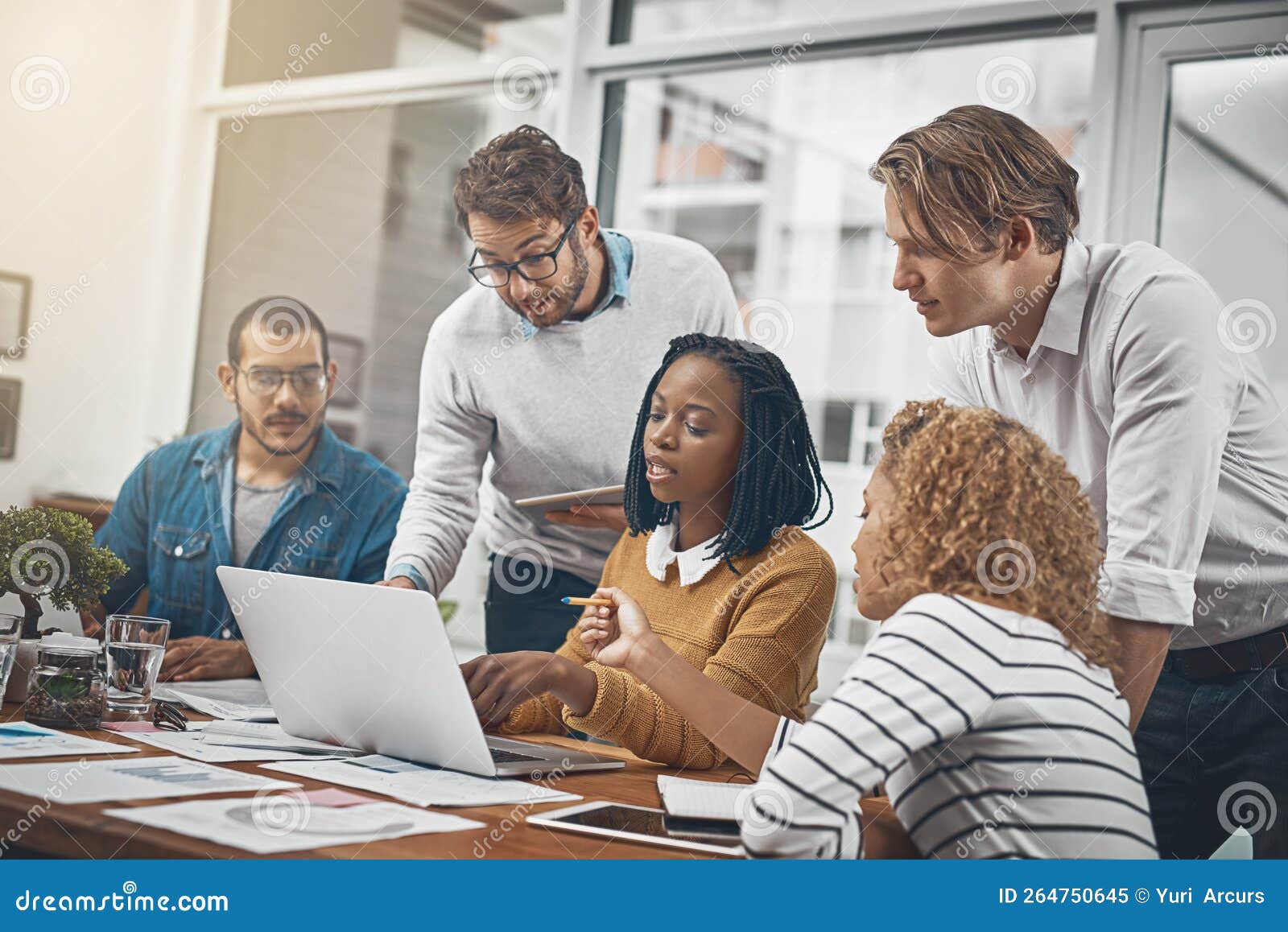 Well Find a Solution Together. a Group of Businesspeople Looking at ...