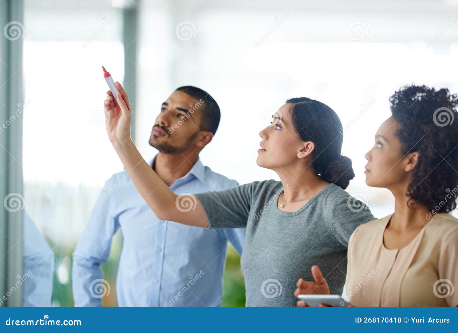 Well Get it Done Together. a Diverse Group of Coworkers Brainstorming ...