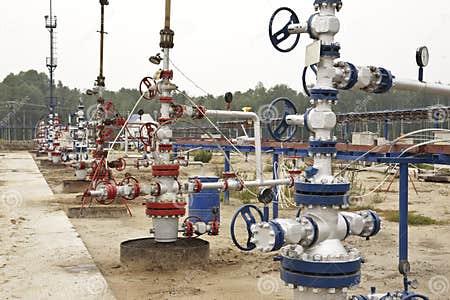 Well in a Row on Multiple Well Platform Stock Image - Image of pressure ...